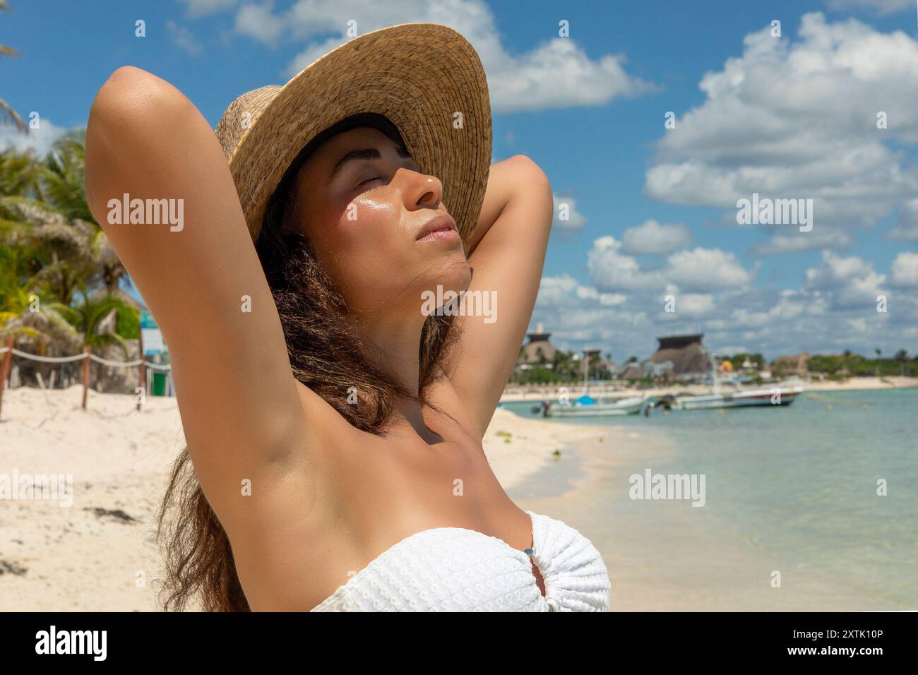 Get inspired by our model's style as she enjoys the Caribbean sun. Her straw hat and beachy look ...