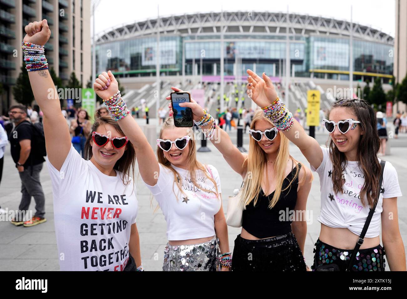 Fans of singer Taylor Swift, called Swifties, arrive at Wembley Stadium ...
