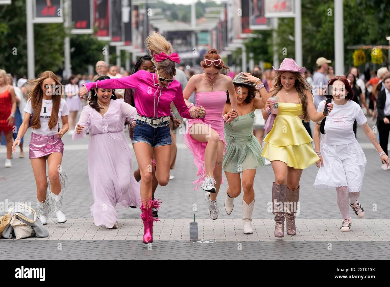 Fans of singer Taylor Swift, called Swifties, arrive at Wembley Stadium ...