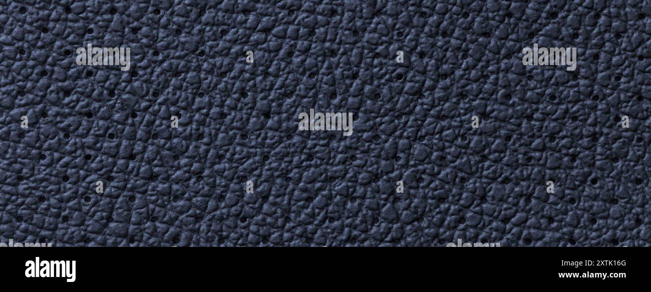 Perforated navy blue leather texture background, closeup. Denim ...