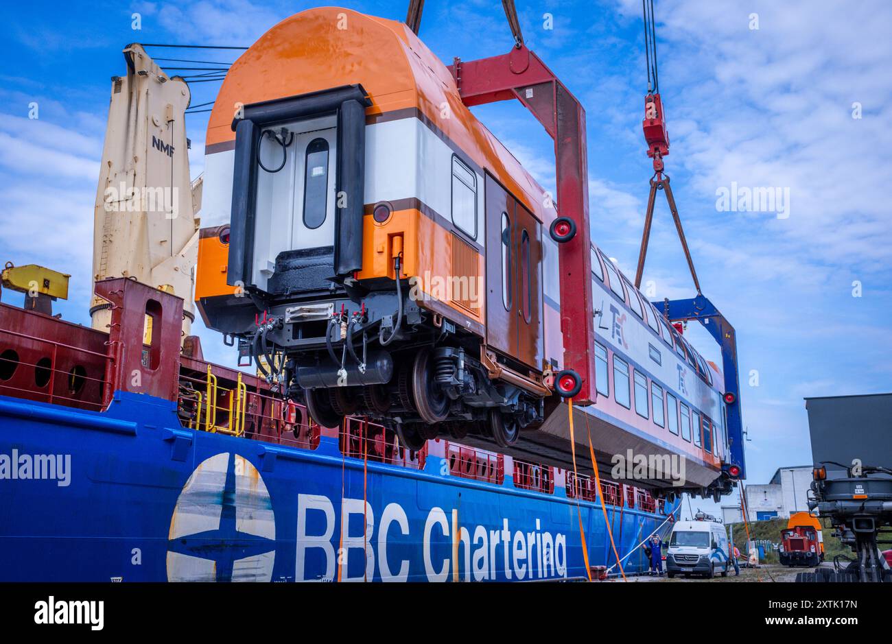 Mukran, Germany. 15th Aug, 2024. Modernized double-decker wagons are ...
