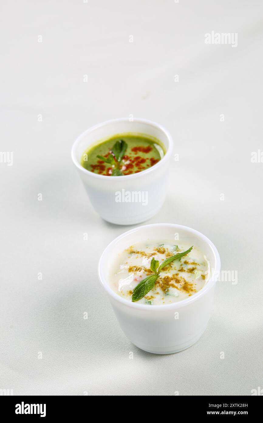 Restaurant Style Vegetable Raita and Green Chutney Stock Photo - Alamy