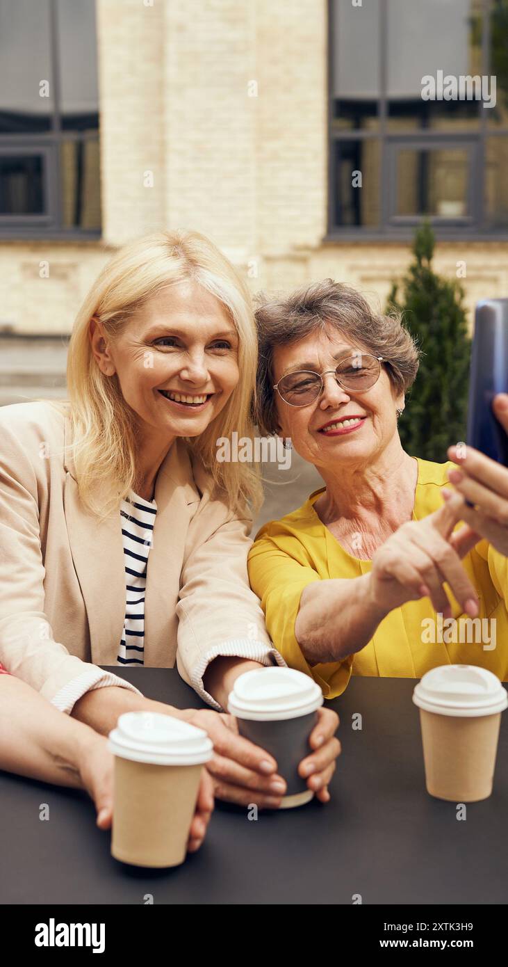 A Joyful Coffee Moment Shared Between Friends Captured in a Beautiful ...