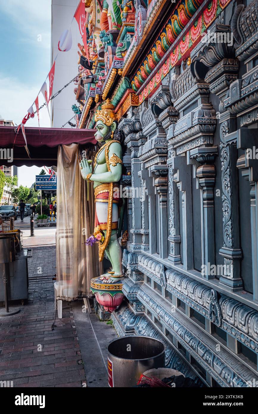 Detailed view of a Hindu temple's exterior, showcasing colorful statues ...