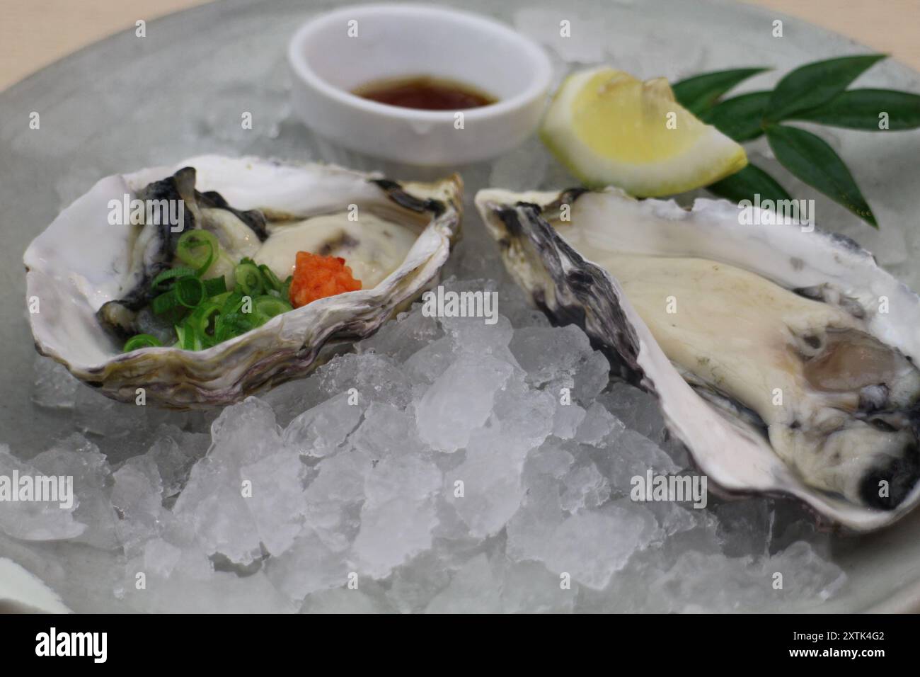 Japanese cuisine: raw oysters in Miyajima, Hiroshima, Japan Stock Photo ...
