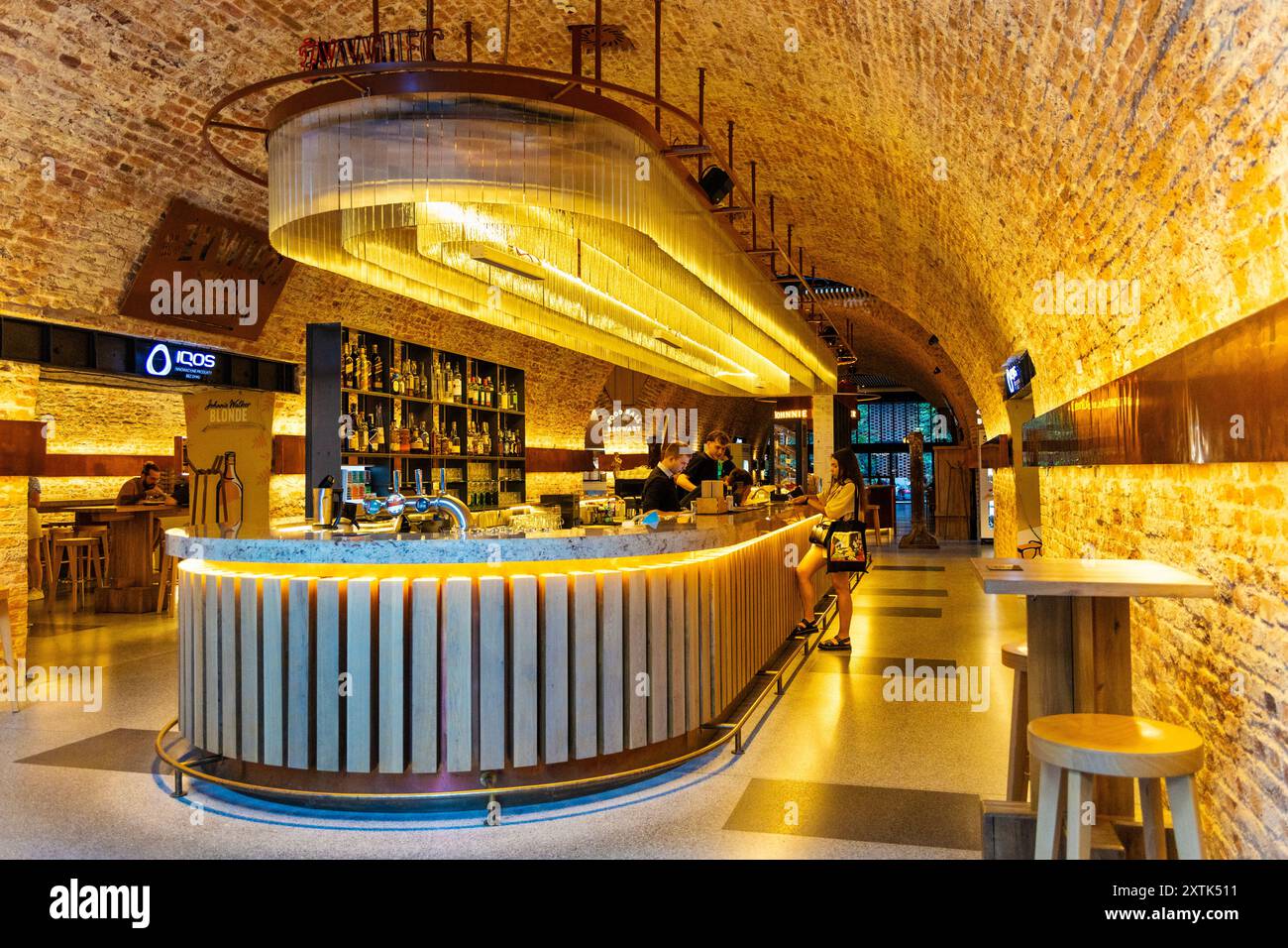 Food hall bar inside renovated historic cellars of Warsaw Breweries ...