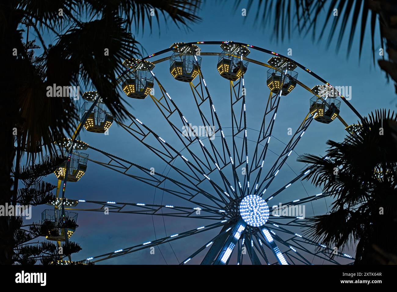 The Ferris wheel in Saranda at night against a colorful sky Stock Photo ...