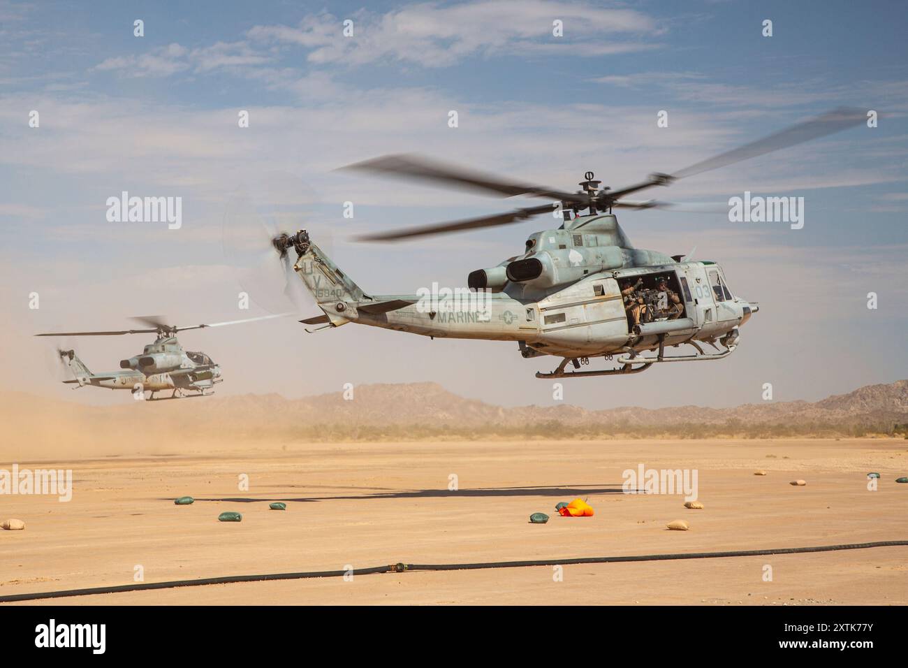 A U.S. Marine Corps UH-1Y Venom and AH-1Z Viper assigned to Marine ...