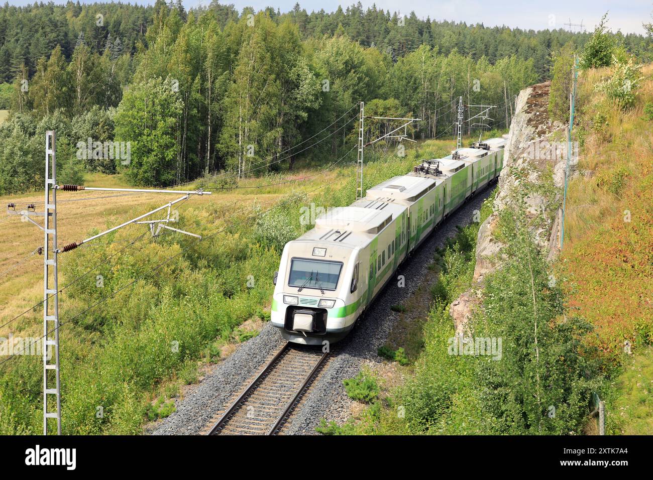 Pendolino Express train of VR group travelling from Kupittaa to Helsinki through rural scenery ...