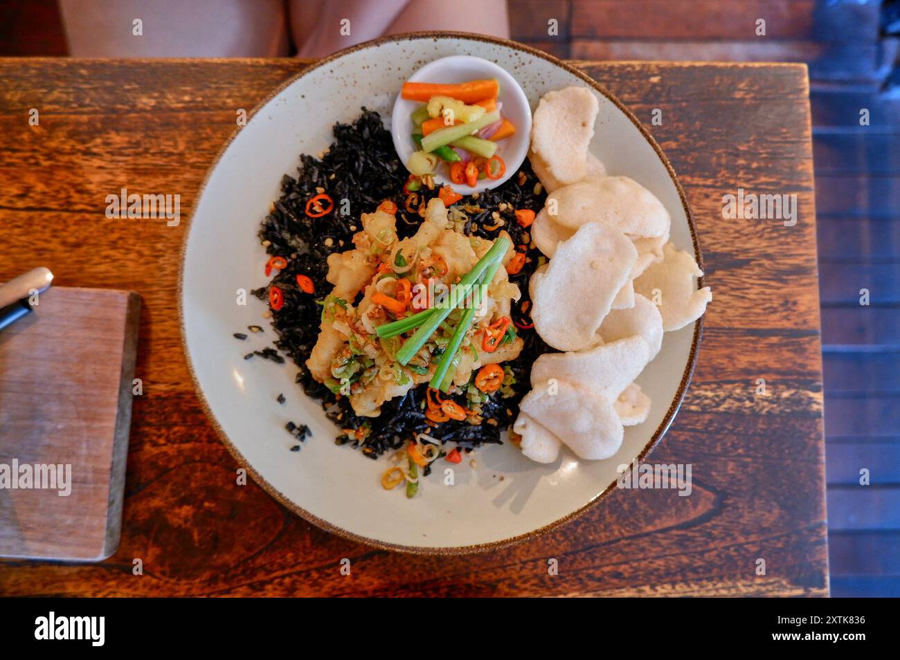 The Famous Squid Ink Rice by Kilo Kitchen, Bali Stock Photo - Alamy