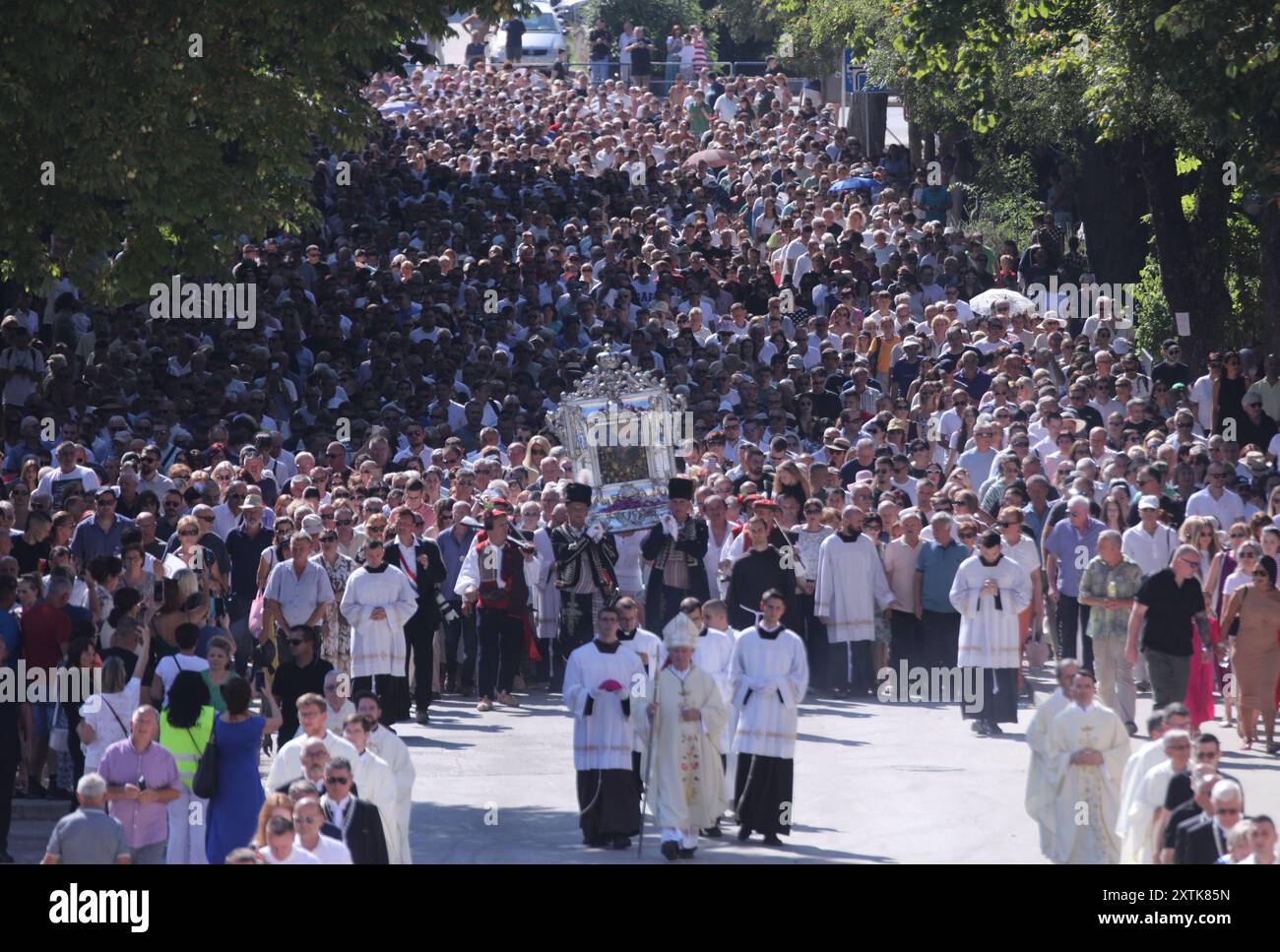 Sinj, Croatia. 15th Aug, 2024. Roman Catholic priests carry The ...