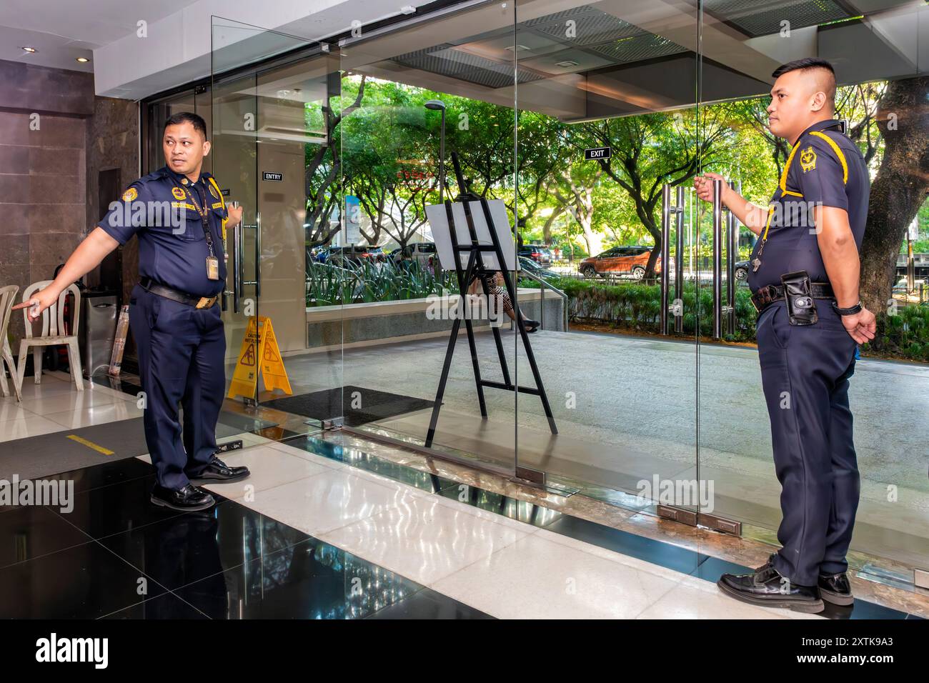 Doormen and security guards, office building at 8747 Ayala, Makati ...