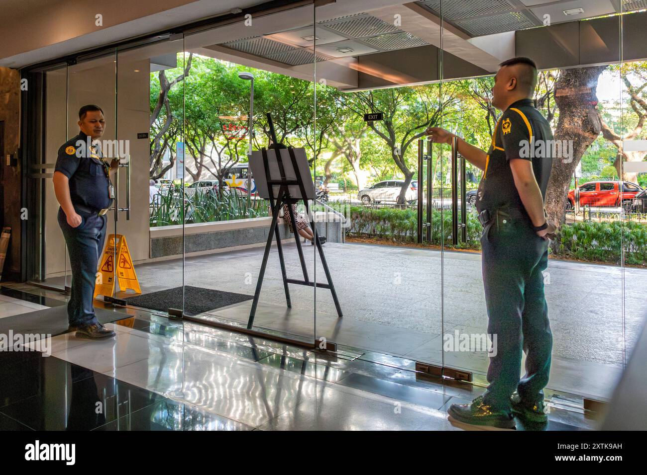 Doormen and security guards, office building at 8747 Ayala, Makati ...
