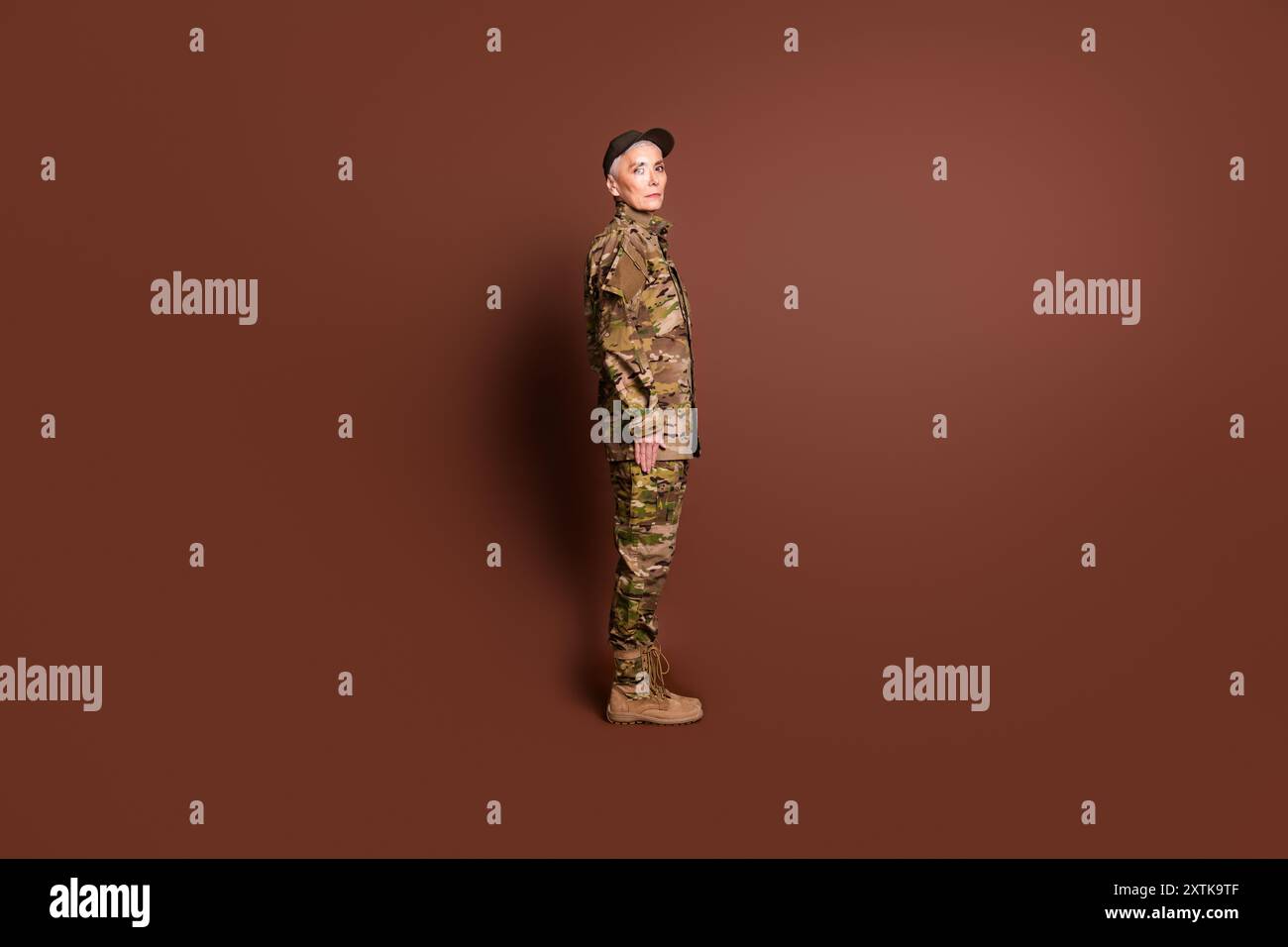 Full size photo of senior female courageous servicewoman stand profile ...