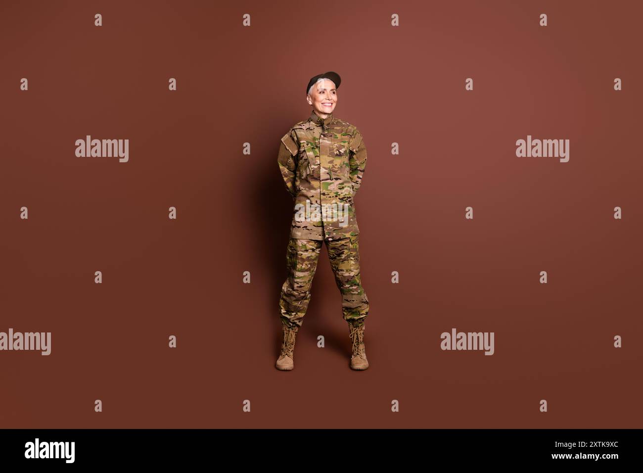 Full length photo of pensioner lady officer look empty space hands ...