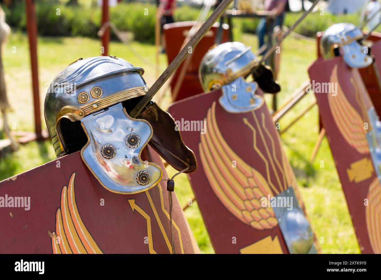 Ancient Roman legionary helmets on red legionary shields Stock Photo ...