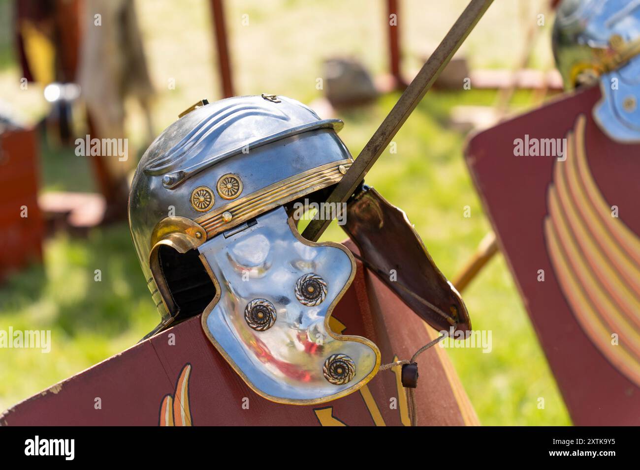 Ancient Roman legionary helmets on red legionary shields Stock Photo ...