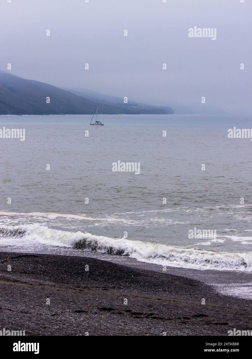 Small wave breaking on the shingles beach of Aberystwyth, in Wales ...