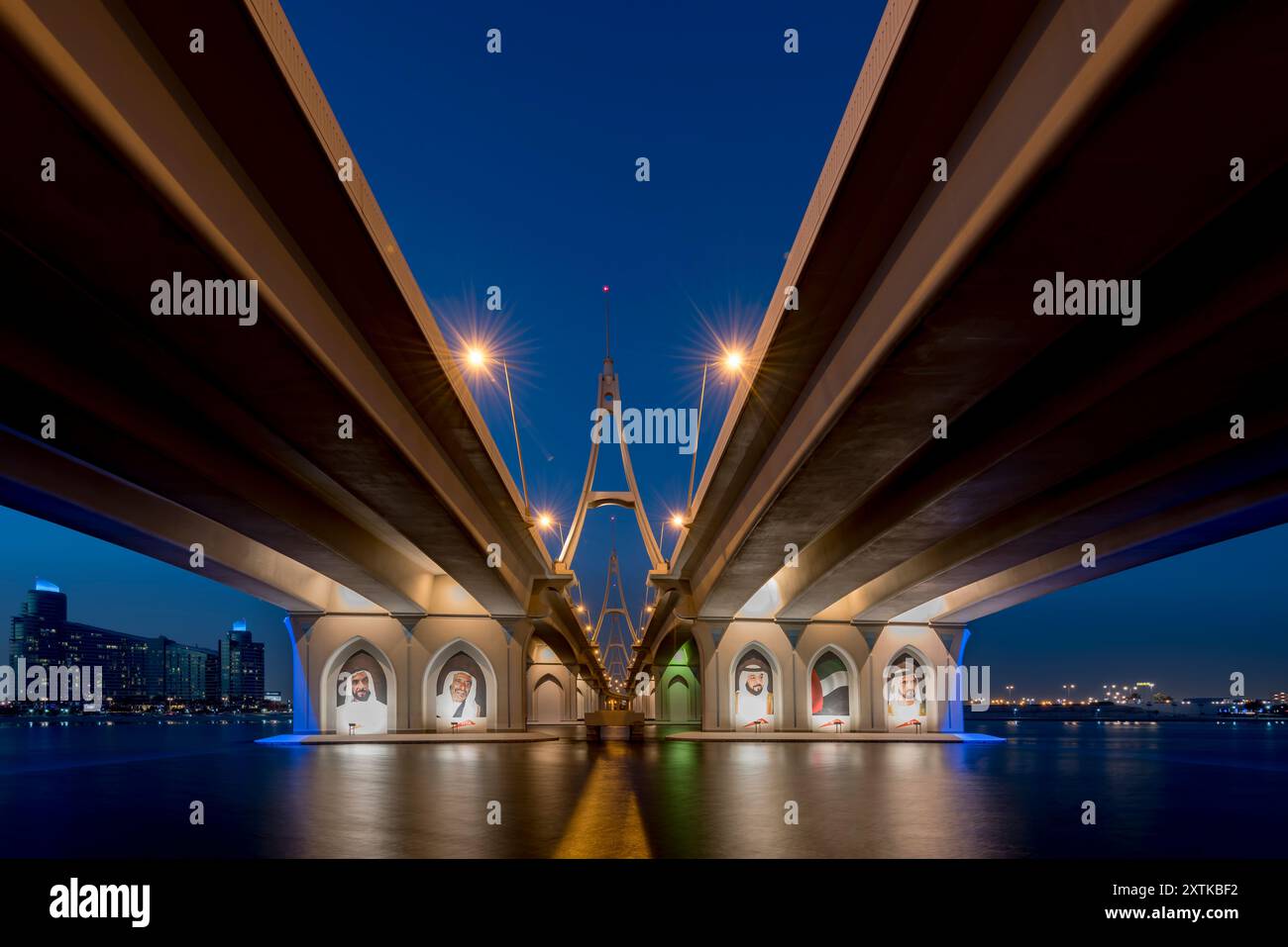 Business Bay Crossing Bridge at sunset featuring portraits of UAE and ...
