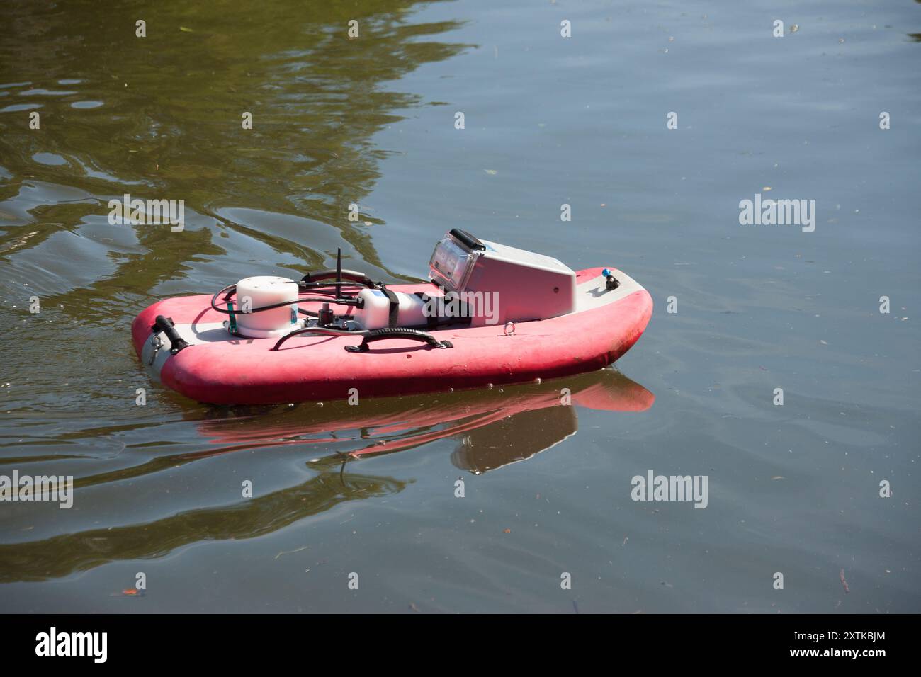 R/C boat measuring flow and velocity of river Stock Photo - Alamy