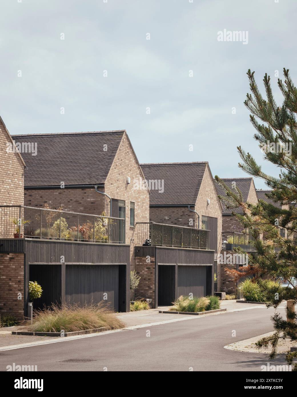 Street view with garages and balcony, railing and cladding detail ...