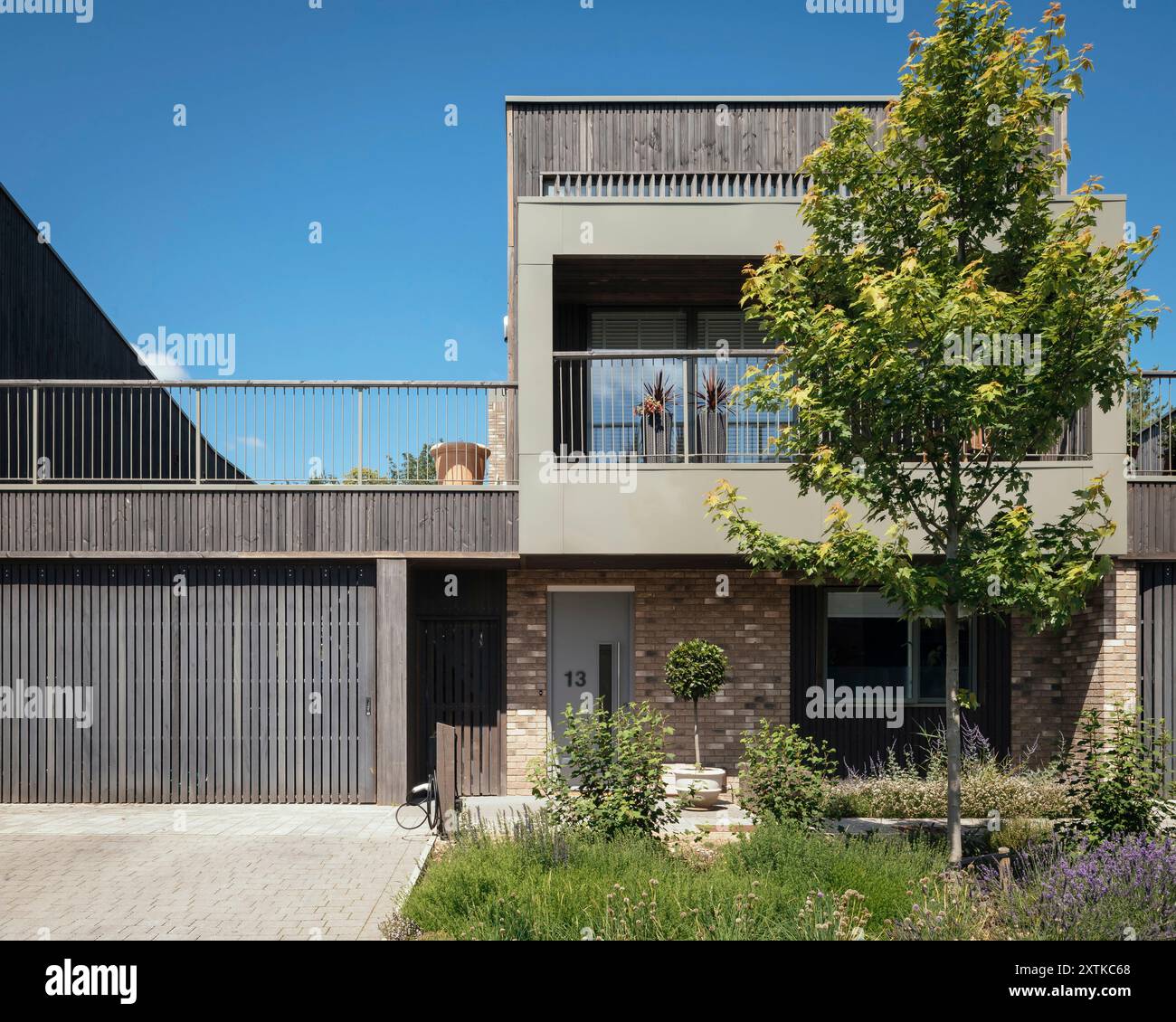 Street view with garage and balcony, railing and cladding detail ...