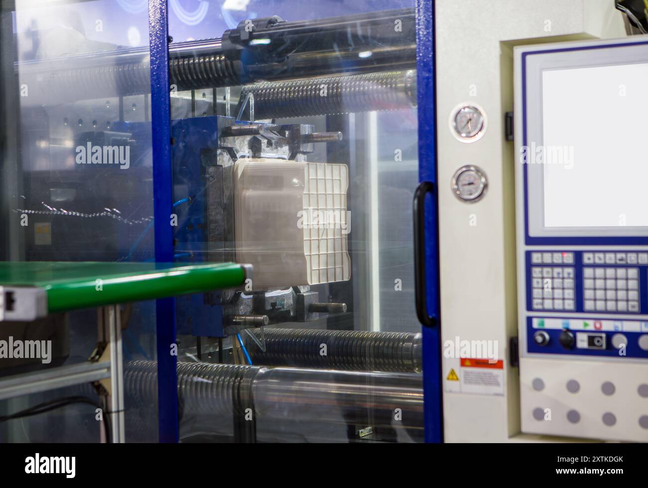 Process of plastic buckets on plastic injection molding press machine ...