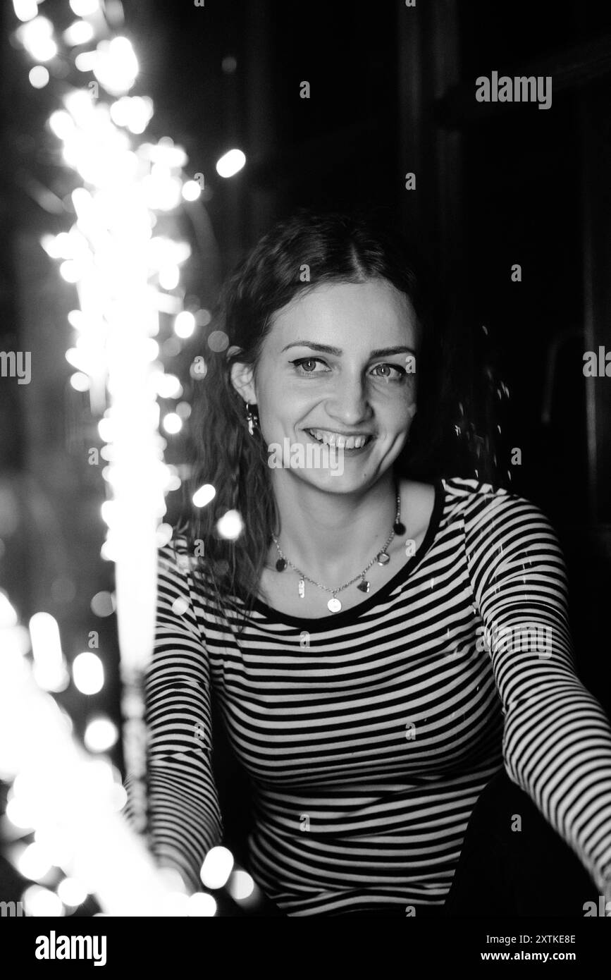 girl lit sparklers inside a wooden house late at night Stock Photo - Alamy