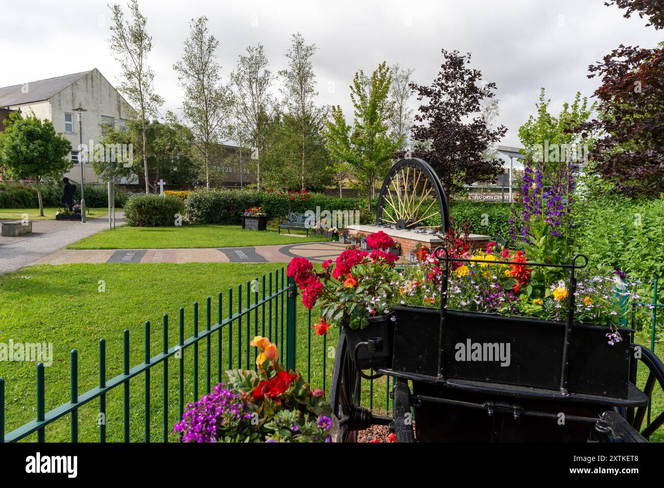 Sacriston, County Durham, UK. Coal tub floral display and pit wheel ...