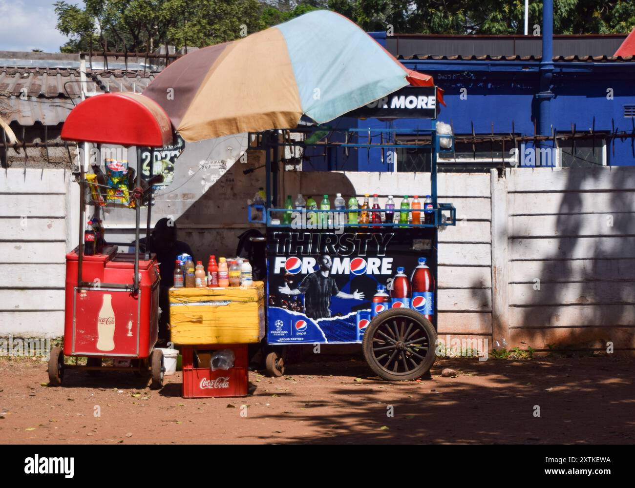 Harare, Zimbabwe. 27th April 2024: A street vendor sells cold drinks in ...