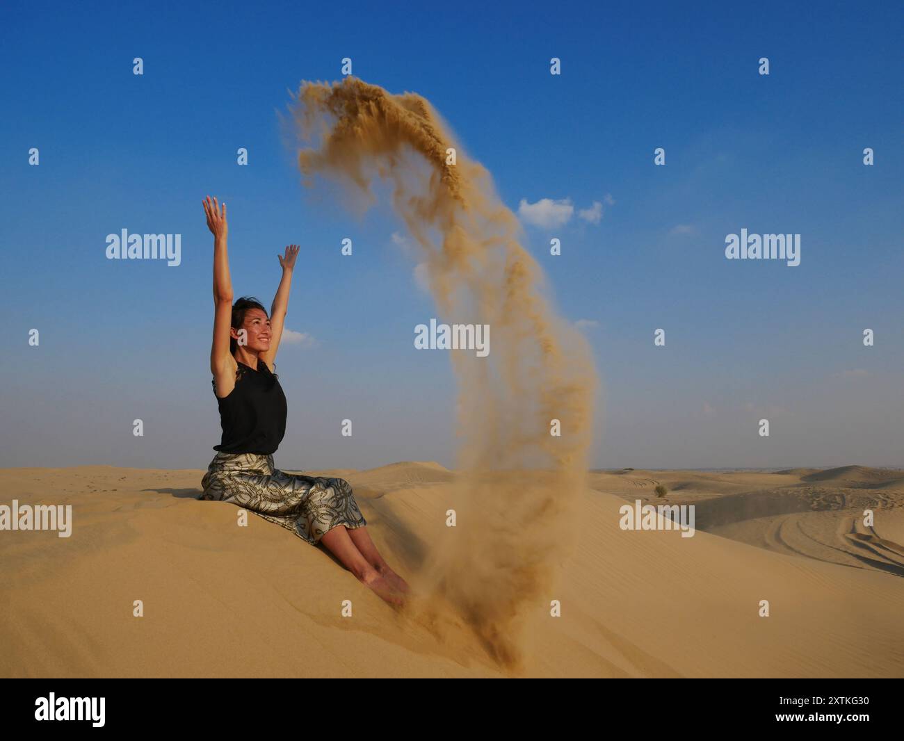 Happy girl in desert hi-res stock photography and images - Alamy