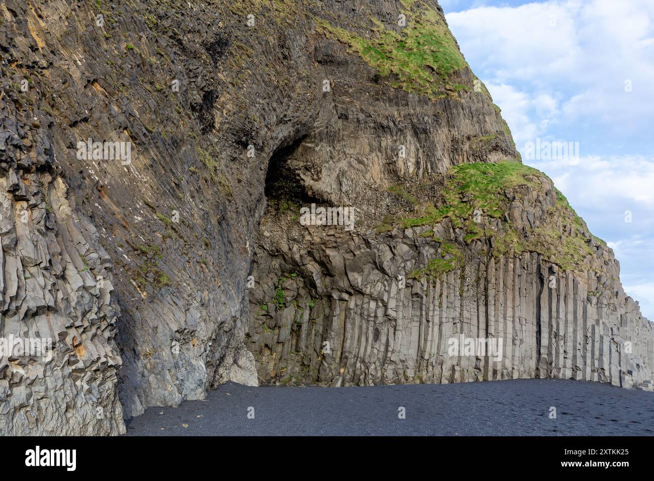 Basalt hexagonal columns rock formations on Reynisfjara Black sand beach, Iceland Stock Photo ...