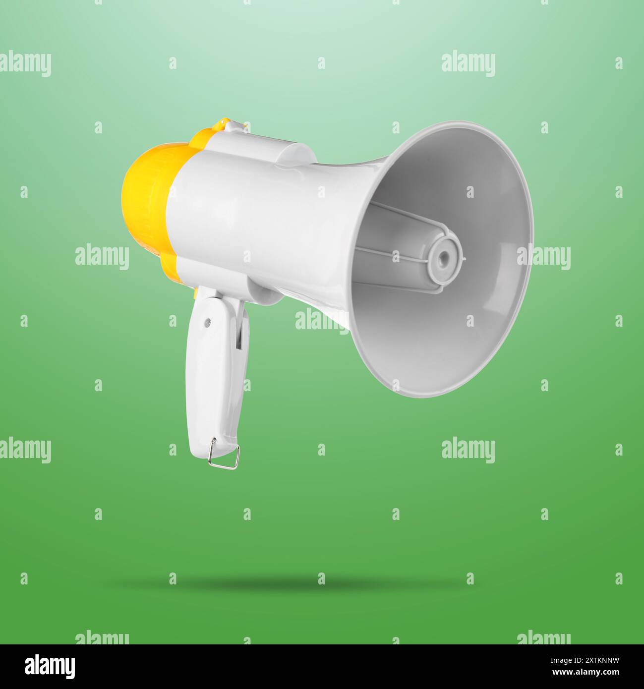 Wireless megaphone in air on green gradient background Stock Photo - Alamy