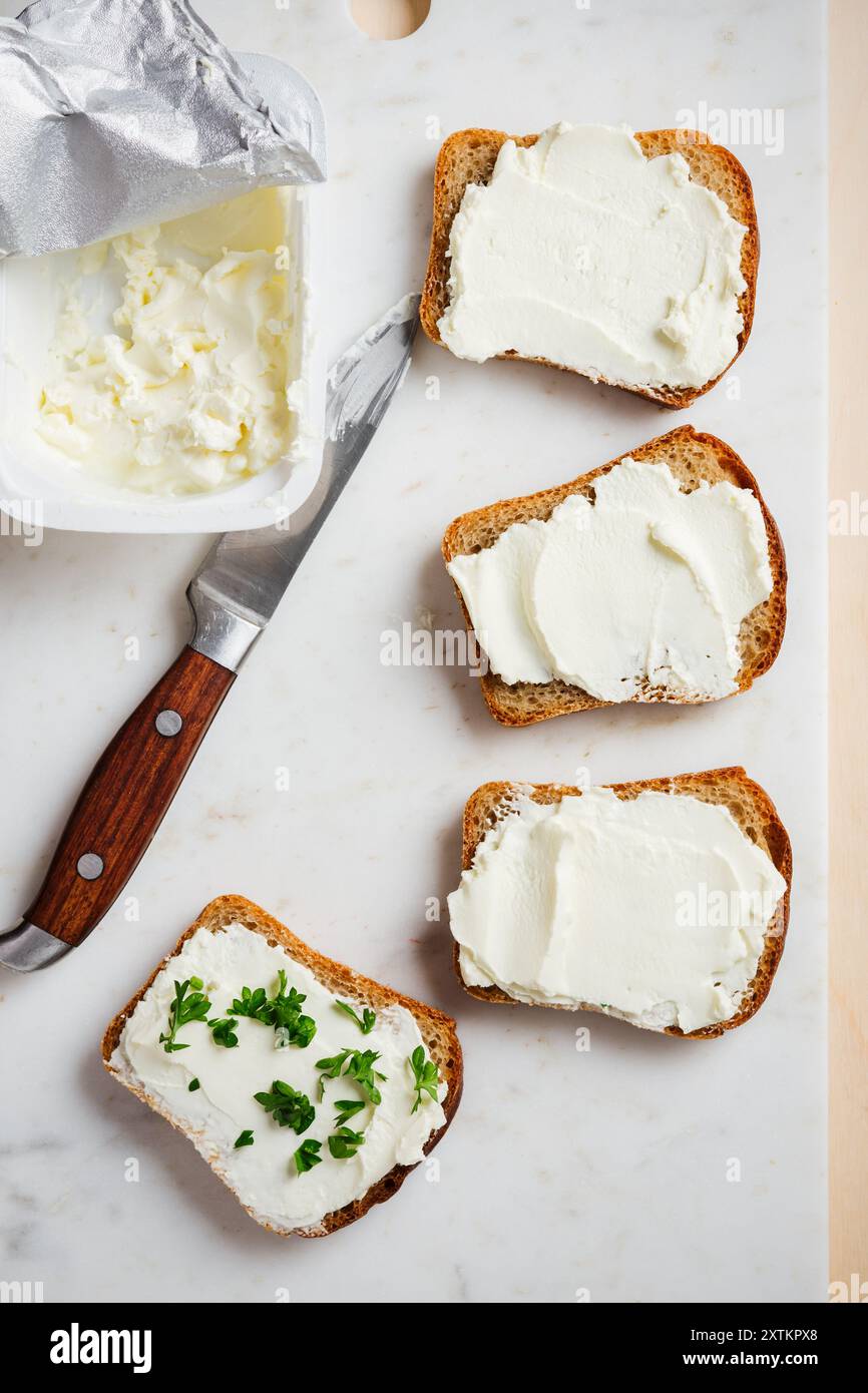 Cream cheese toast on marble, top view Stock Photo - Alamy