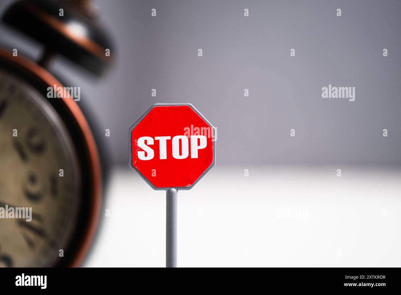 Sign Stop on background alarm clock. Concept of stopping time Stock ...