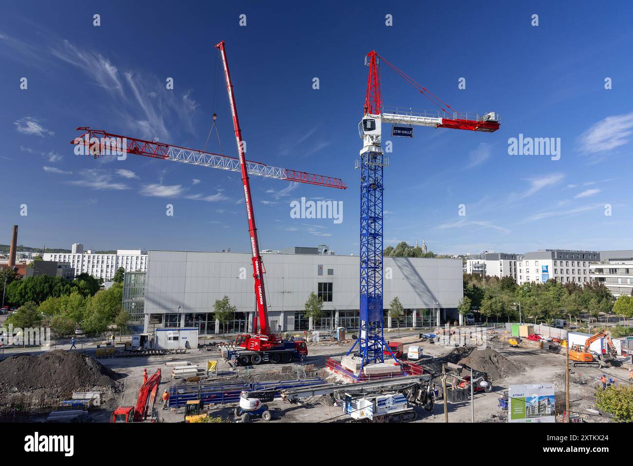 Nancy - View on a red mobile crane Liebherr assembling a Liebherr tower ...