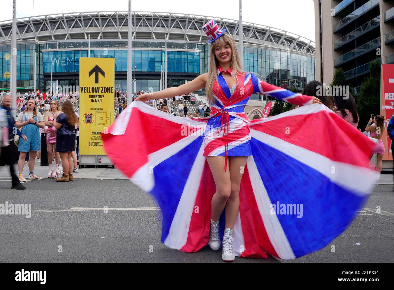 Fans of singer Taylor Swift, called Swifties, arrive at Wembley Stadium ...