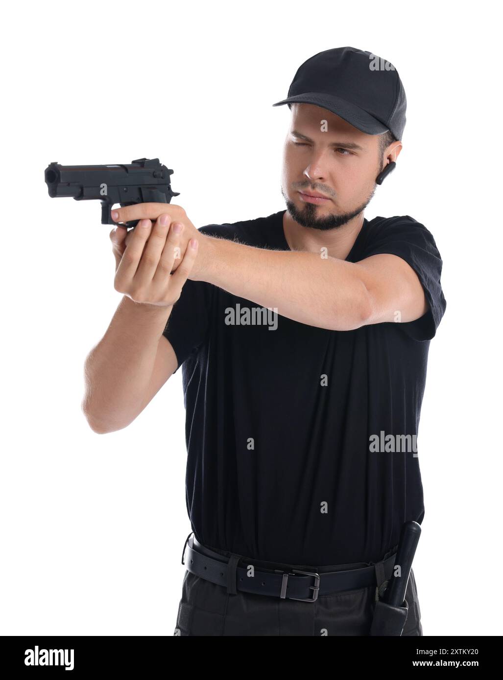 Young bodyguard using gun on white background Stock Photo - Alamy
