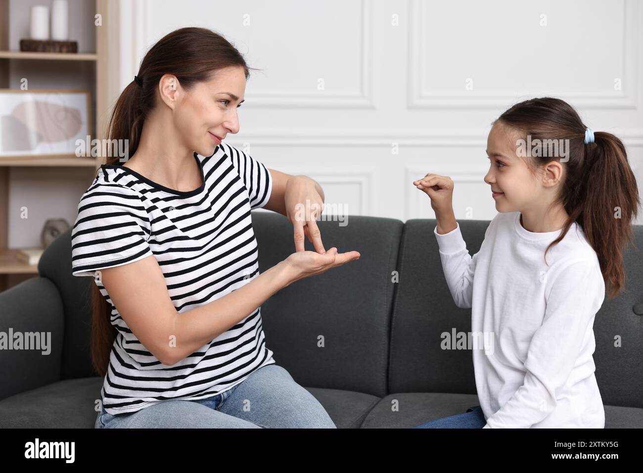 Deaf child adult using sign language hi-res stock photography and ...