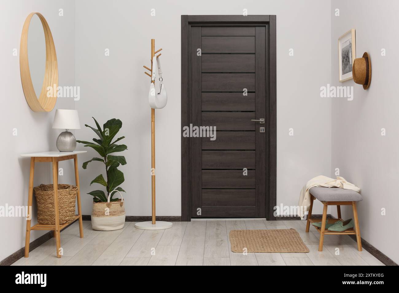 Coat rack, mirror and green plant in hallway. Interior design Stock ...