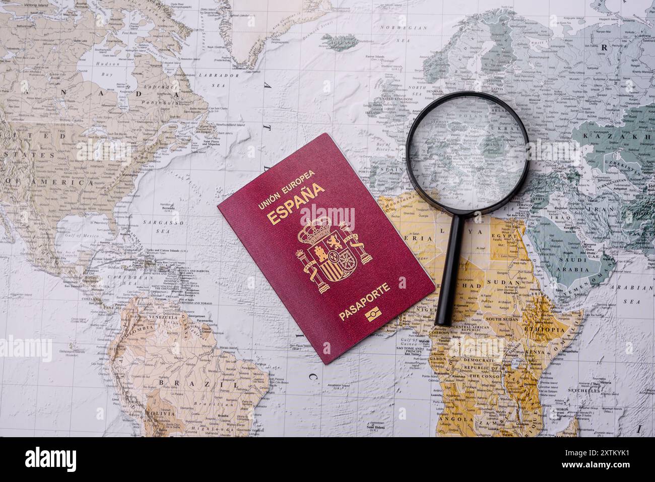 Conceptual background for travel with passport, magnifying glass, world ...