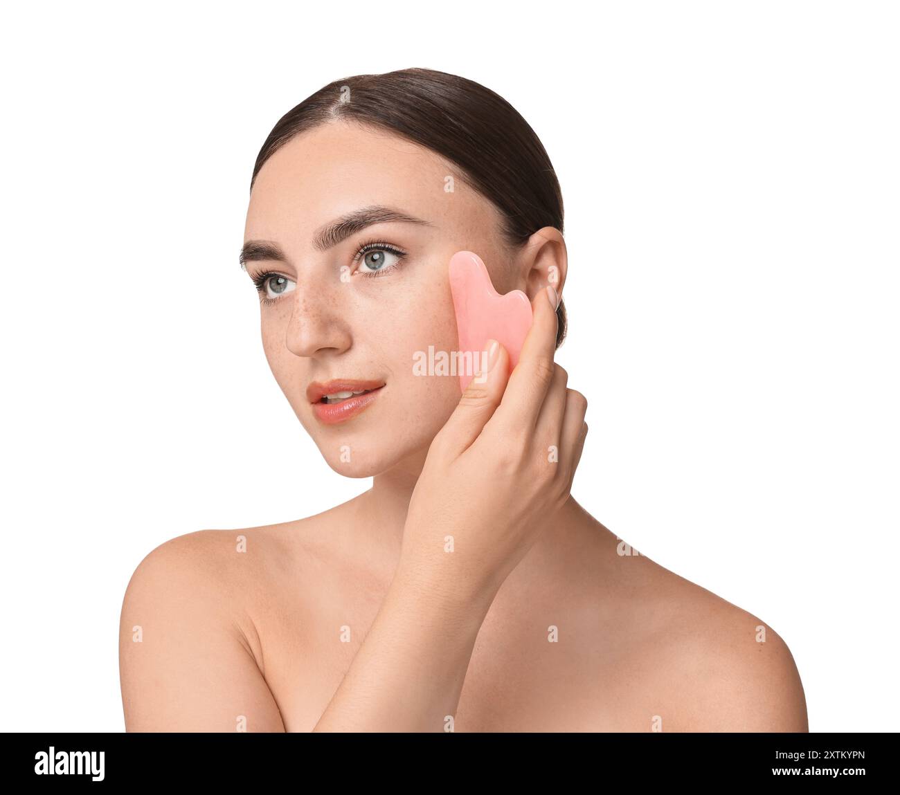 Beautiful young woman doing facial massage with gua sha tool on white background Stock Photo - Alamy