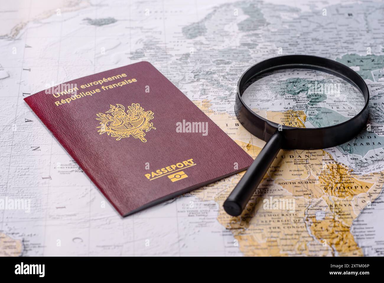 Conceptual background for travel with passport, magnifying glass, world ...