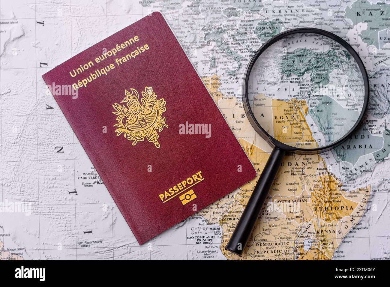 Conceptual background for travel with passport, magnifying glass, world ...