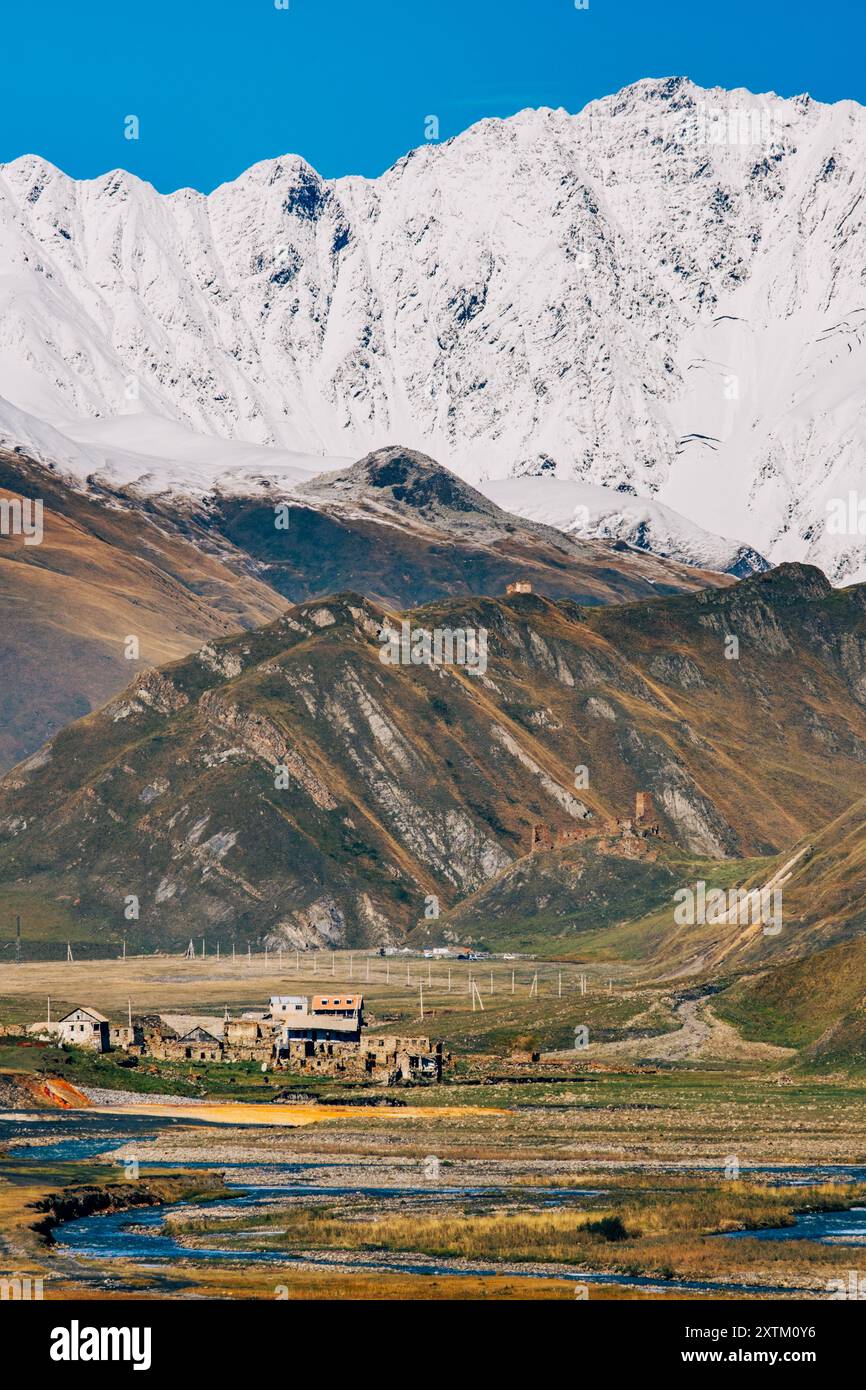 Alpine landscape with the village of Ketrisi, winding rivers, snowy ...