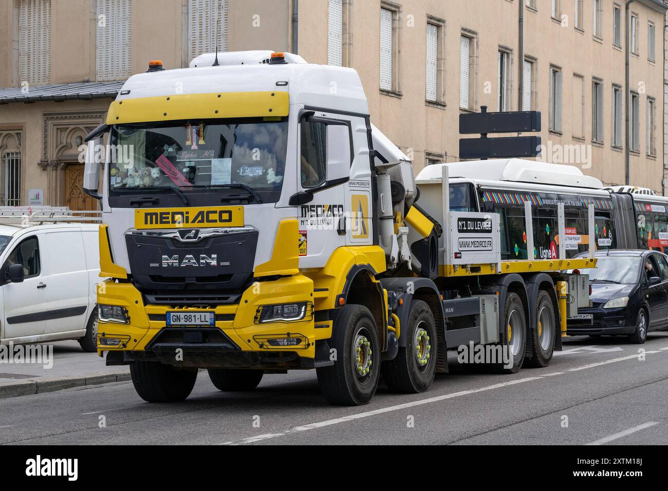 Nancy, France - View on a yellow and white 8X4 truck MAN TGS with a ...