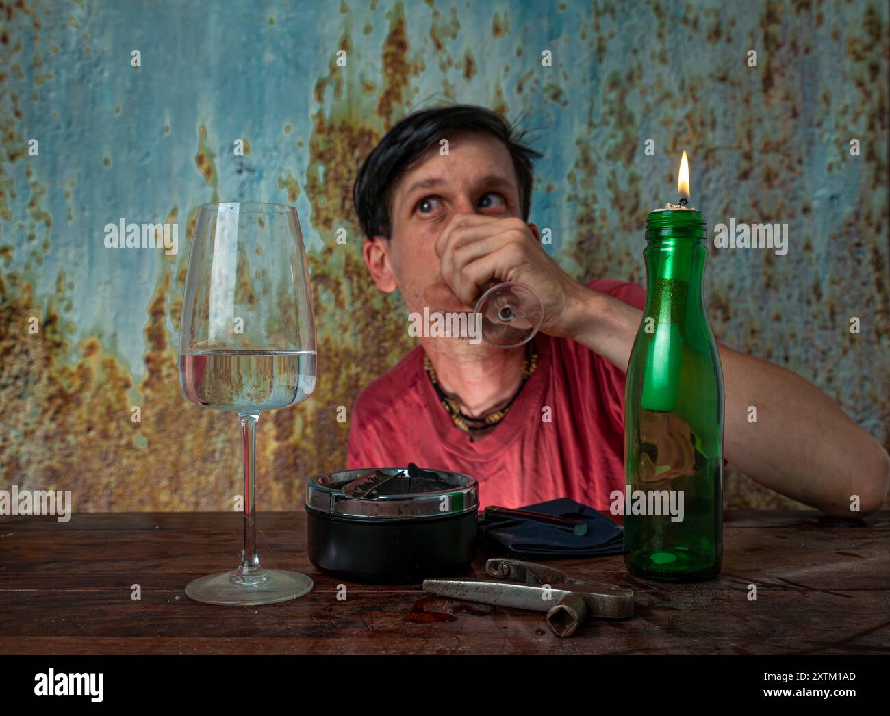 White man with black hair and marijuana joints glasses of alcohol and ...