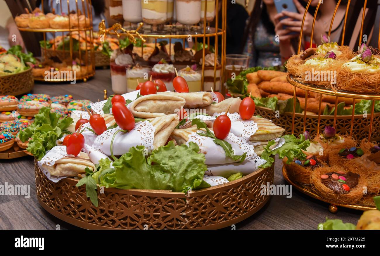 Birthday buffet with appetizers and desserts Stock Photo - Alamy