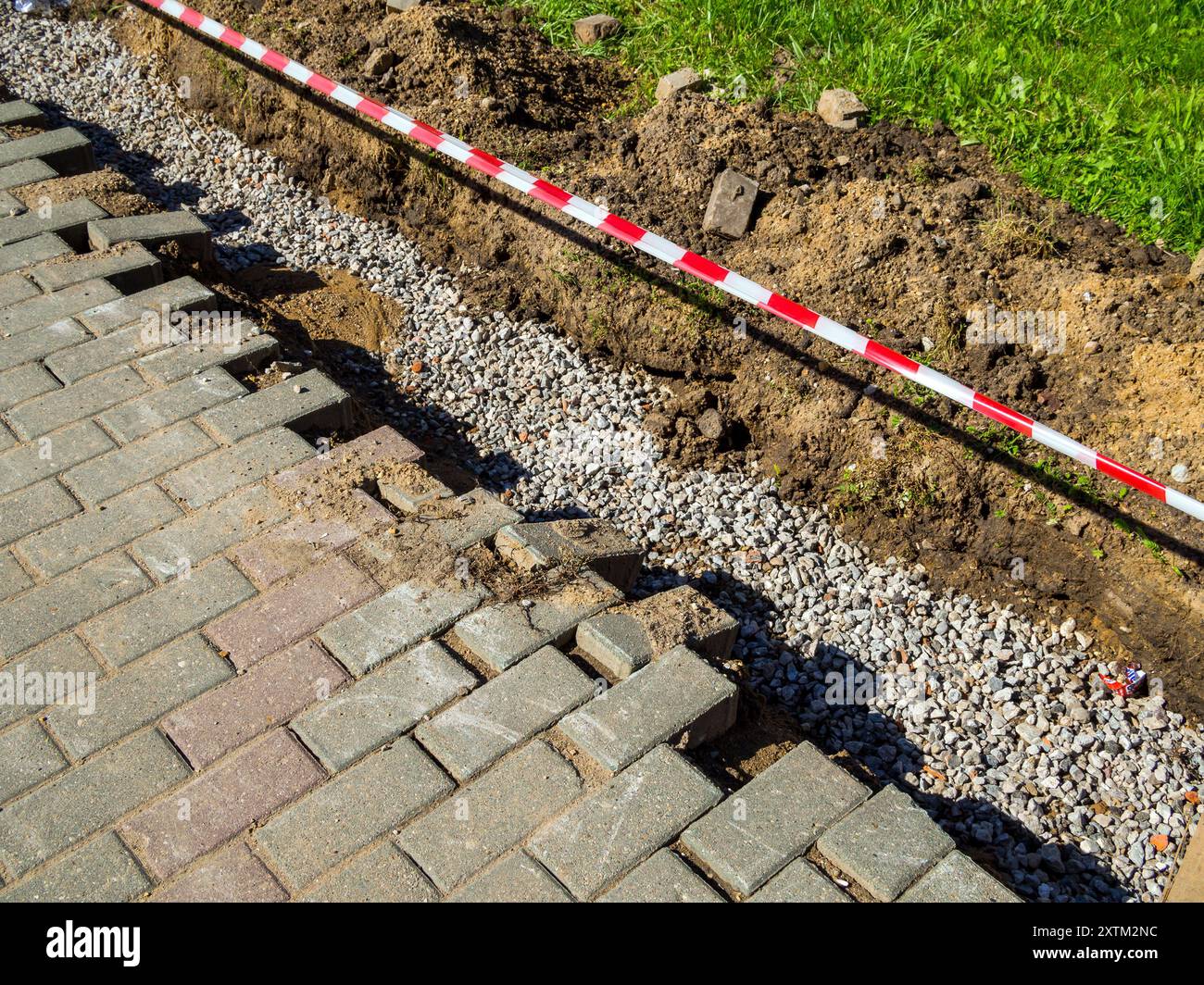 Preparing to install a new sidewalk curb to replace the old one Stock ...