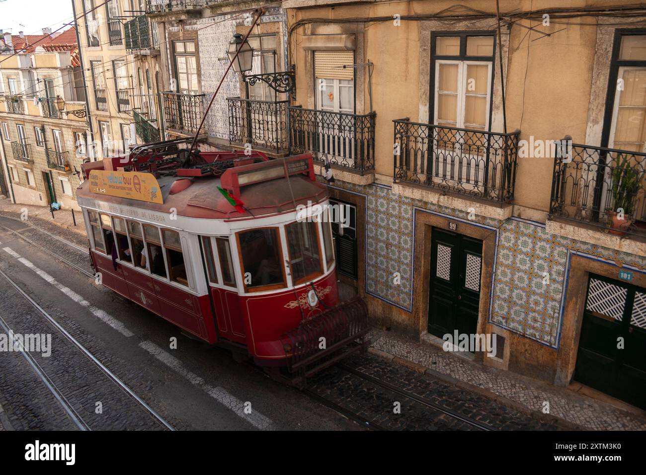 Traditional red tram in the historic district of Lisbon in Portugal in ...